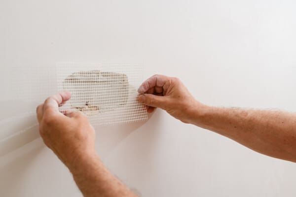 Guide to Repairing Holes in Drywall | QC Paint Pro